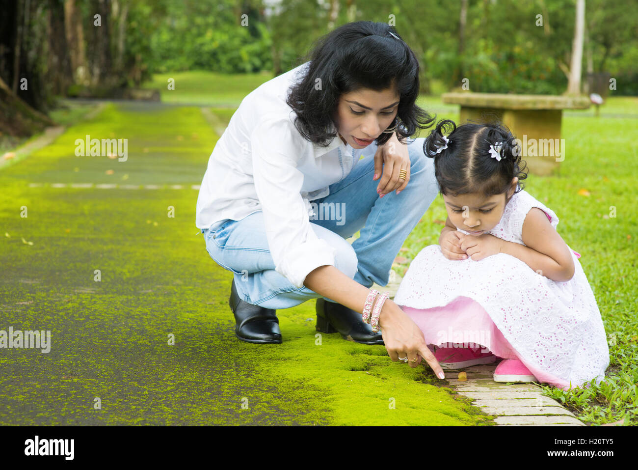 Happy Indian family exploring nature Stock Photo - Alamy