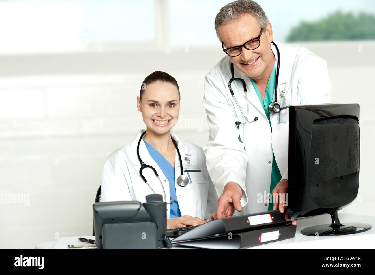 Two cheerful doctors at hospital Stock Photo - Alamy