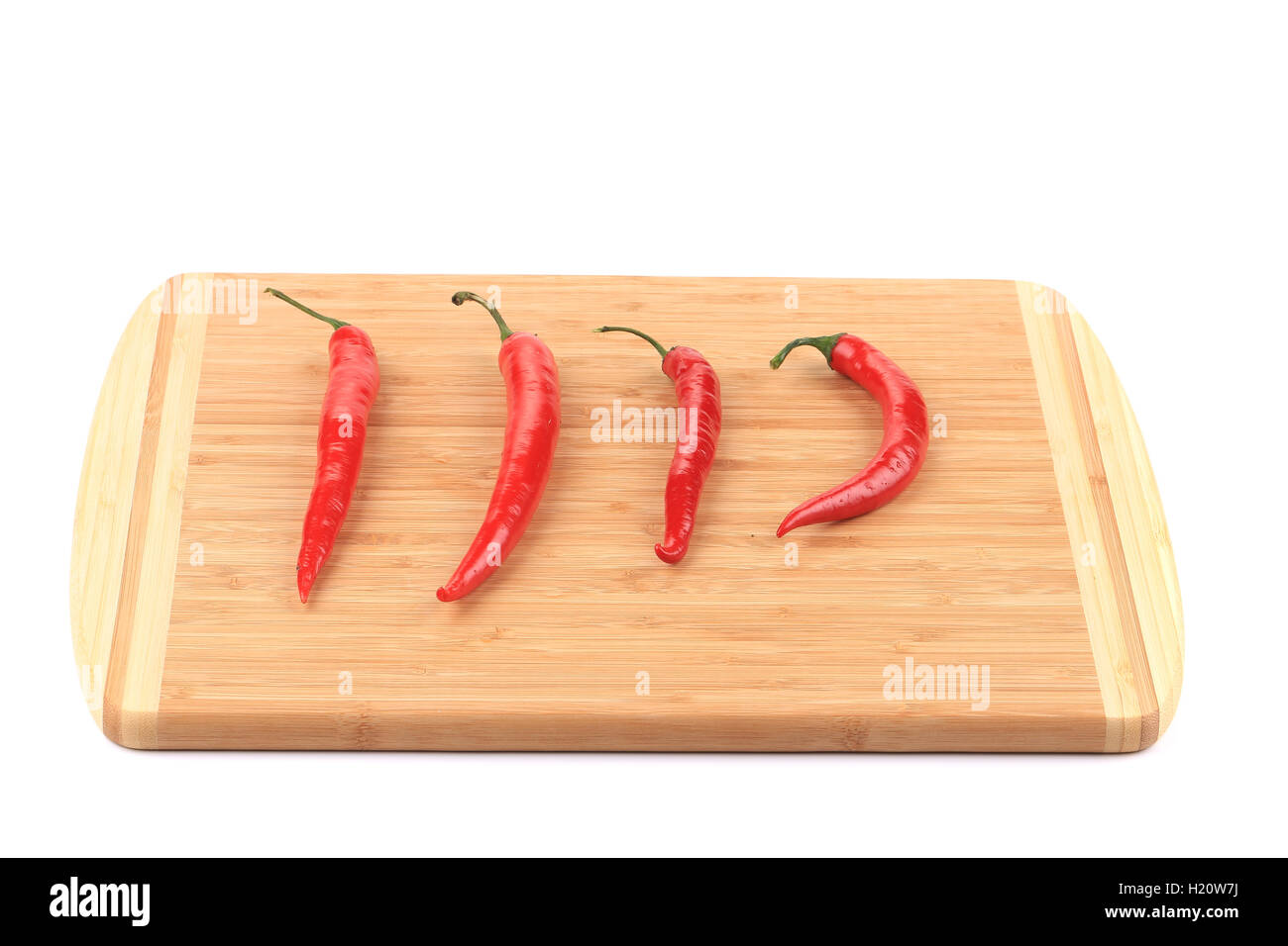 Spicy pepper on cutting board Stock Photo - Alamy