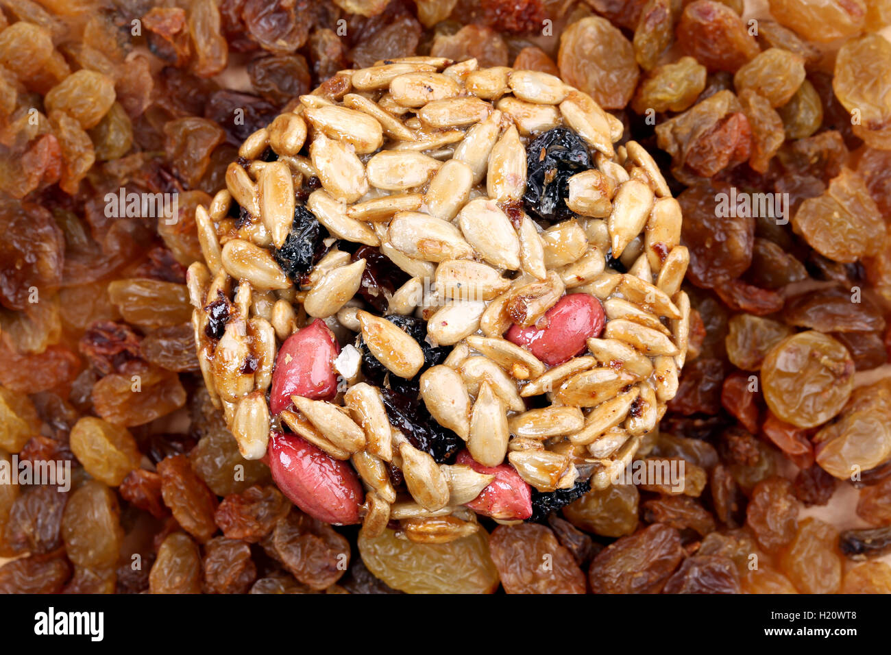 Round candied seeds and nuts with raisins Stock Photo - Alamy