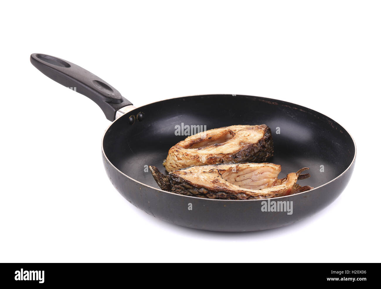 Grilled carp steaks on black pan Stock Photo - Alamy