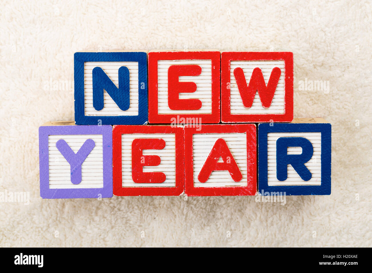 New year wooden toy block Stock Photo - Alamy