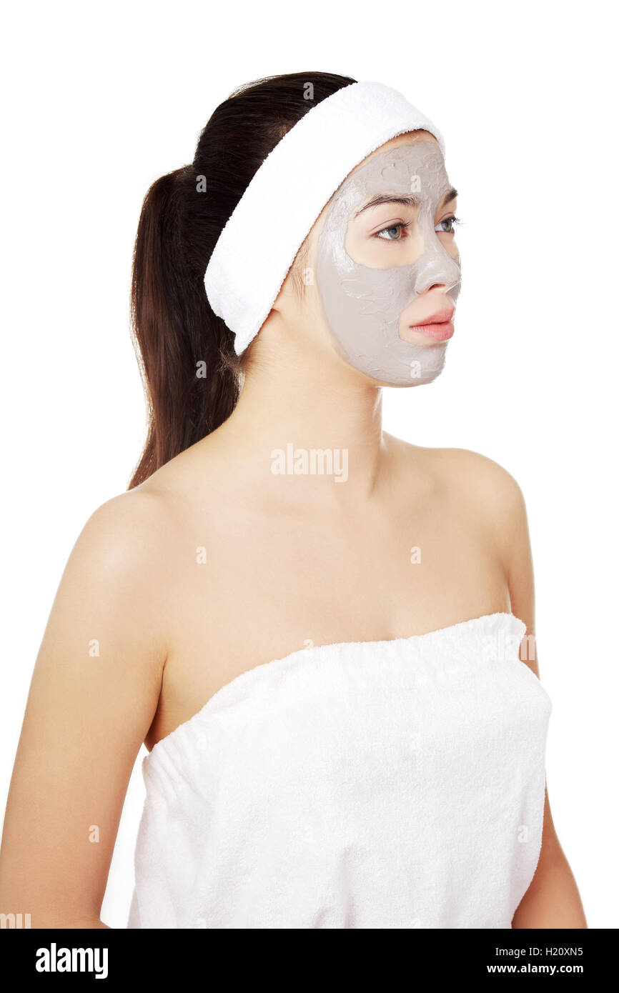 Beautiful woman with clay facial mask Stock Photo - Alamy