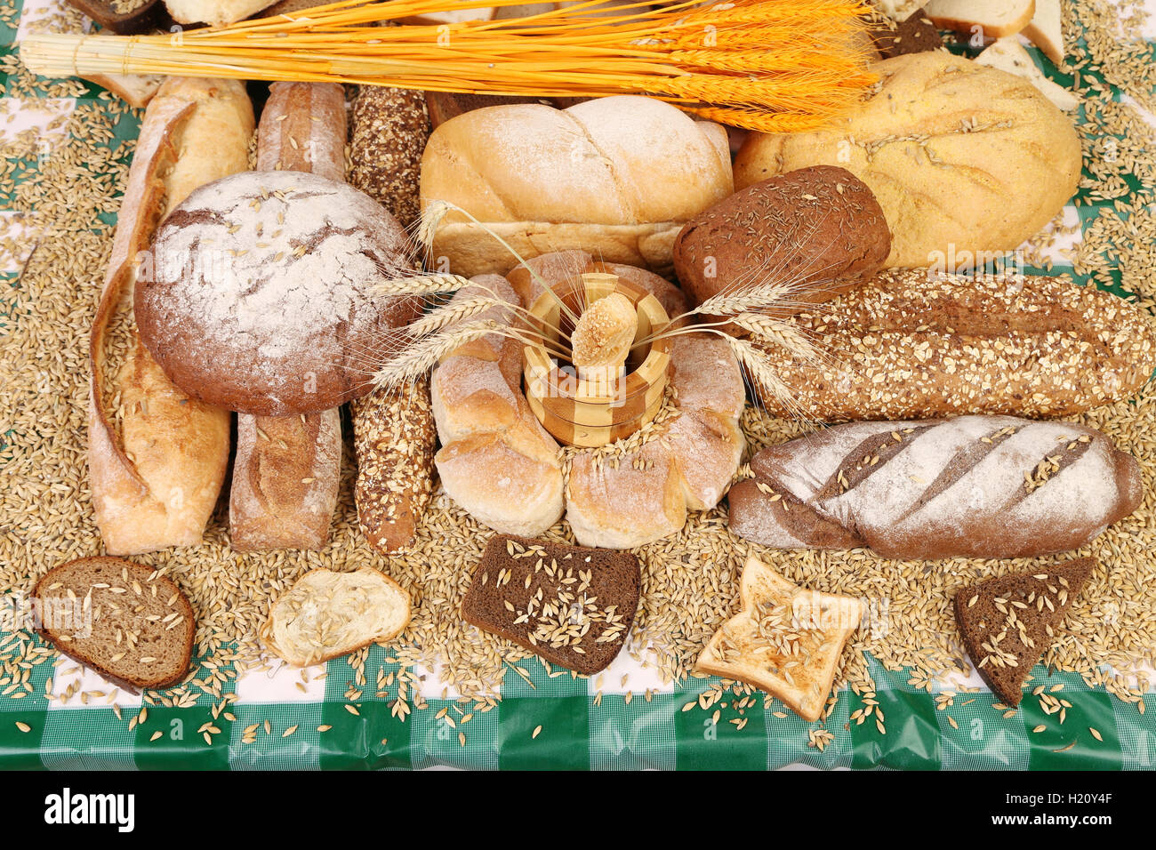 Composition of breads and wheat. Close up Stock Photo - Alamy