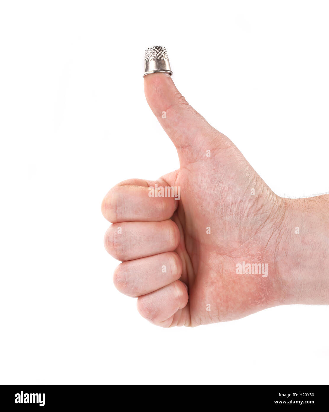 Metal sewing thimble on finger Stock Photo - Alamy