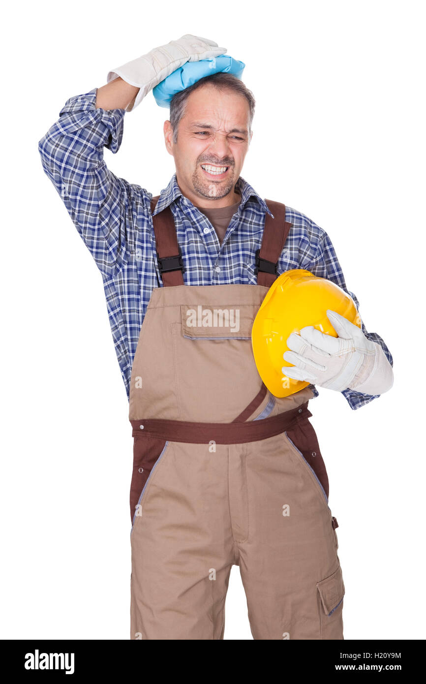 Construction Worker Suffering With Headache Stock Photo - Alamy