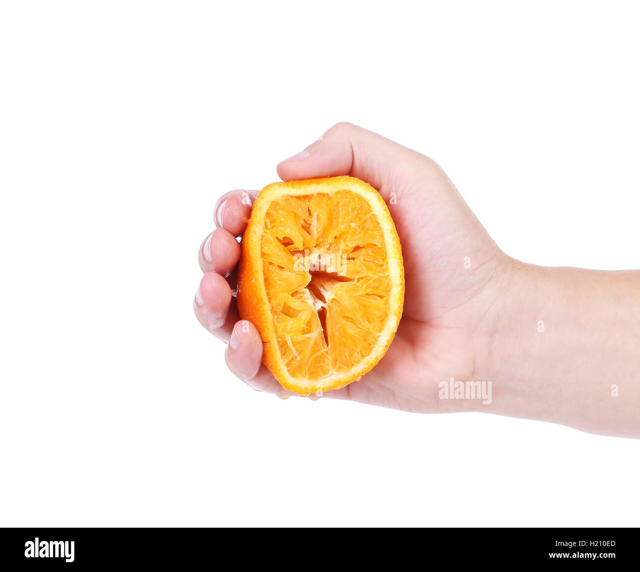Hand squeezing an orange Stock Photo - Alamy