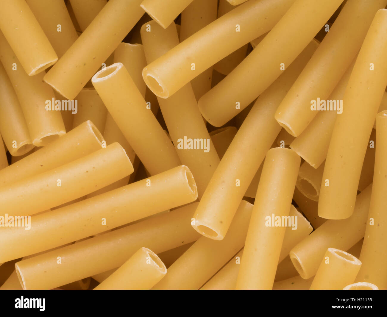 macaroni pasta tubes food background Stock Photo - Alamy