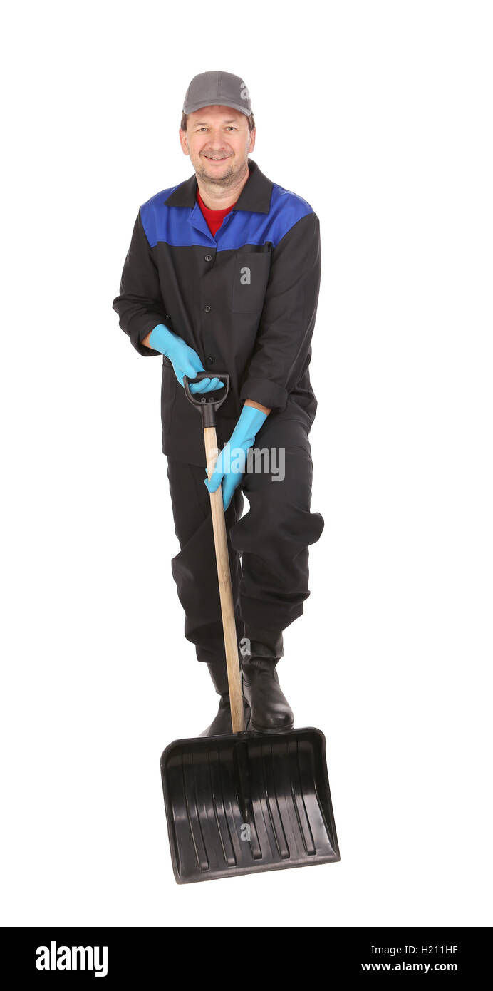 Man holds black shovel Stock Photo - Alamy