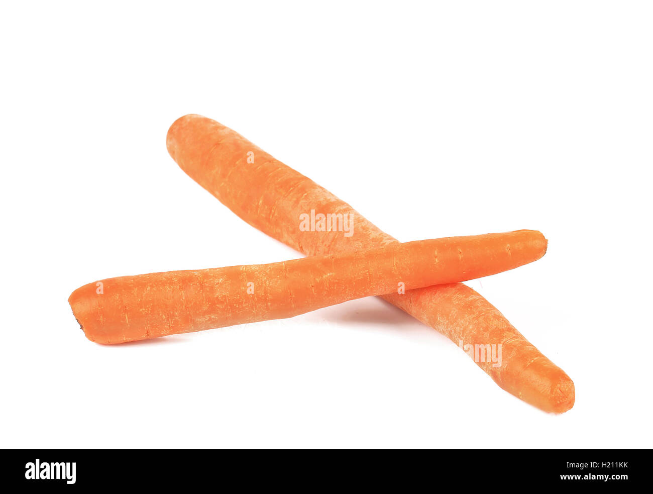 Two fresh carrots cross Stock Photo - Alamy