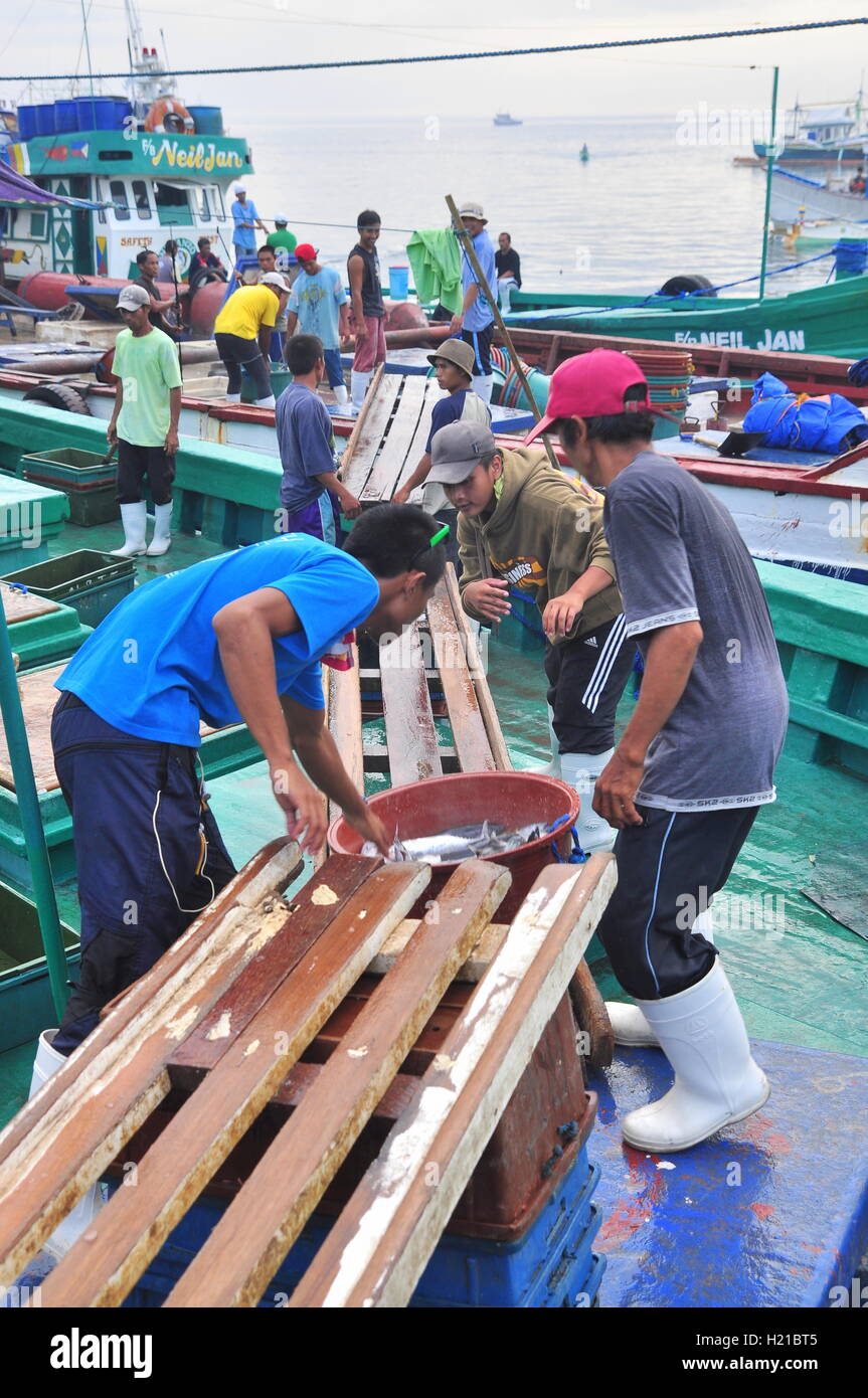 General Santos, Philippines - September 5, 2015: Workers are loading ...