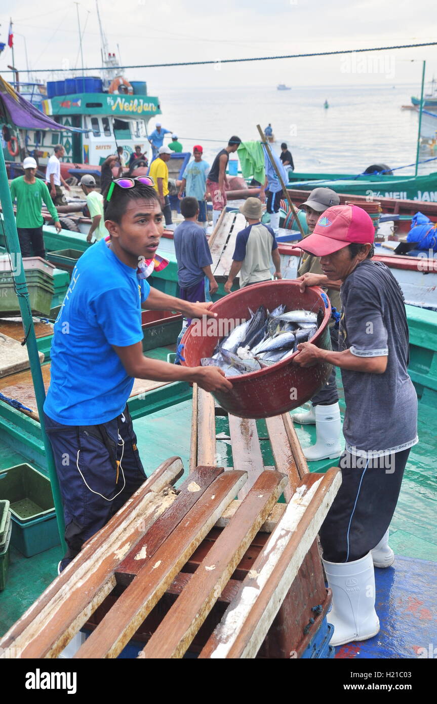 General Santos, Philippines - September 5, 2015: Workers are loading ...