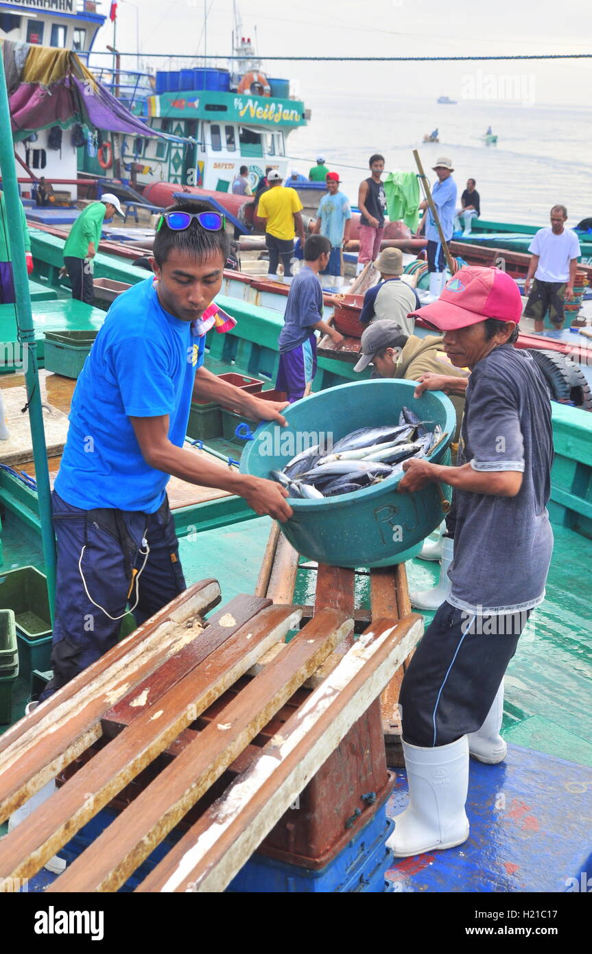 General Santos, Philippines - September 5, 2015: Workers are loading ...