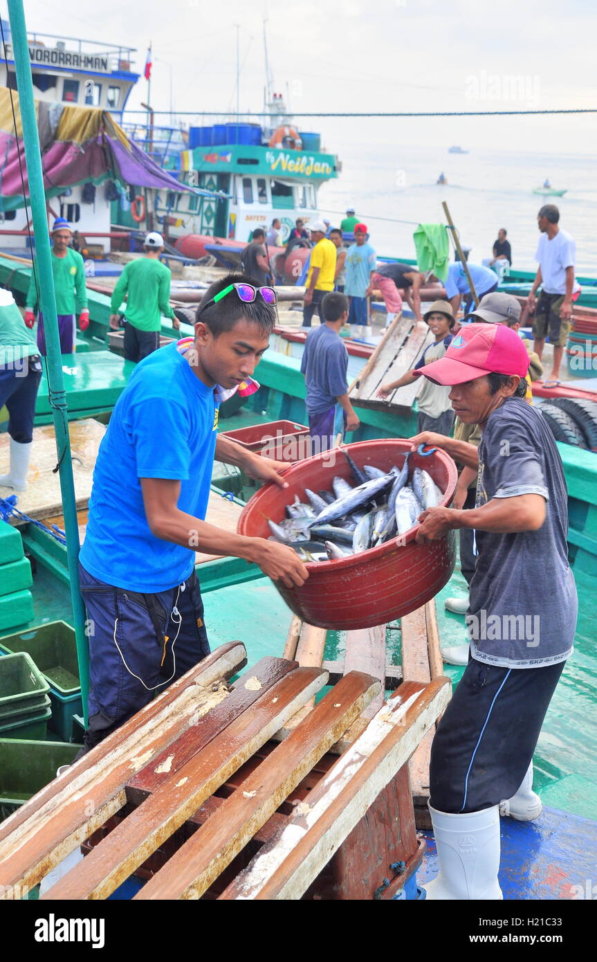 General Santos, Philippines - September 5, 2015: Workers are loading ...