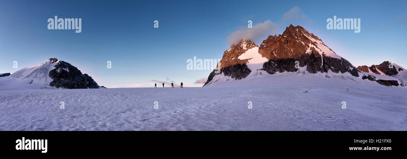 Switzerland, Mountaineers starting early morning from the Bertol Hut ...