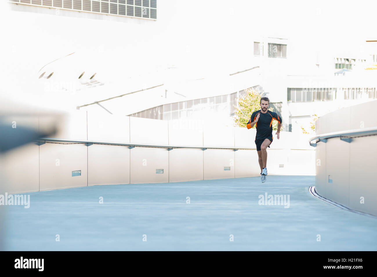 Man running in the city Stock Photo - Alamy