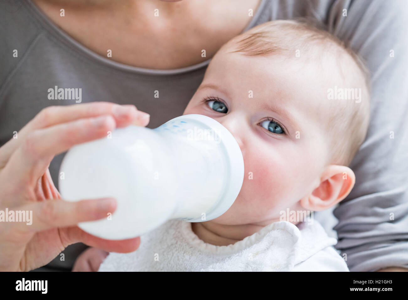 Girl looking milk bottle hi-res stock photography and images - Alamy