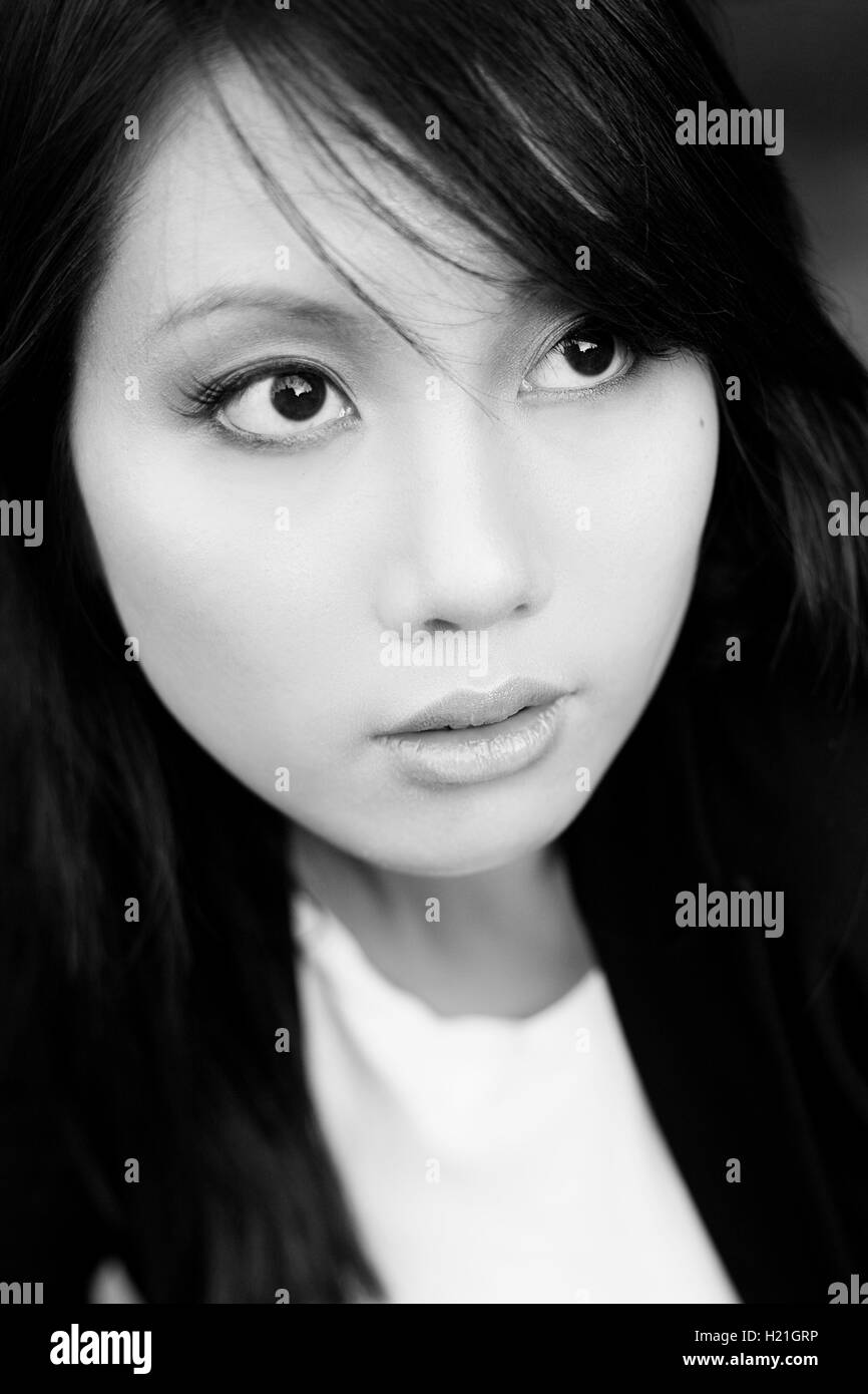 Young woman watching something Stock Photo - Alamy