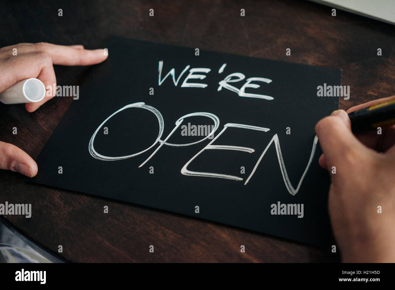 Hand writing open sign Stock Photo - Alamy