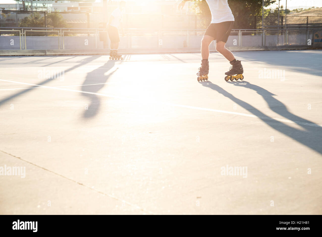 Men with rollerblades skating Stock Photo - Alamy