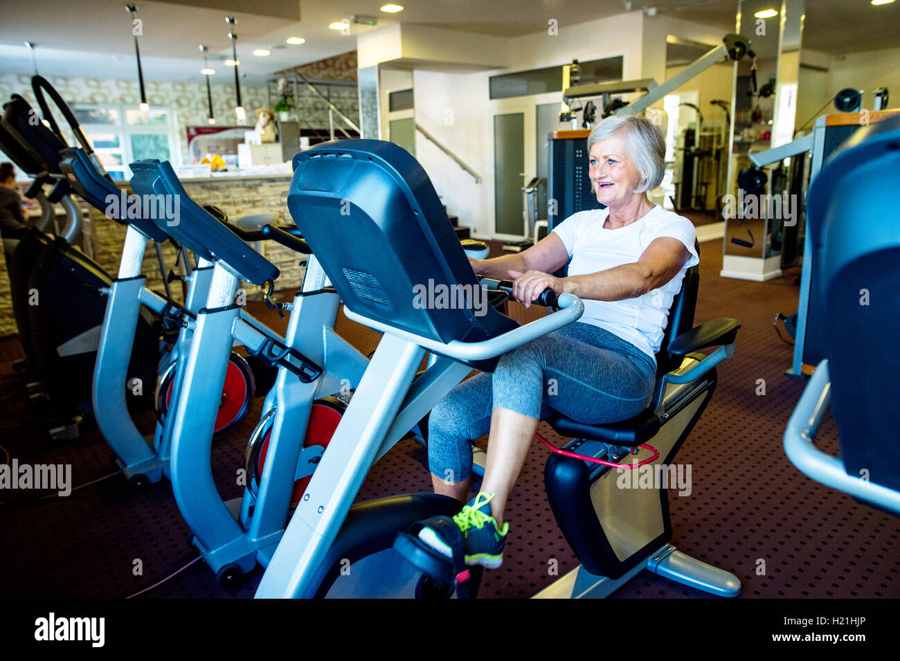 Mature woman working out in fitness gym Stock Photo - Alamy