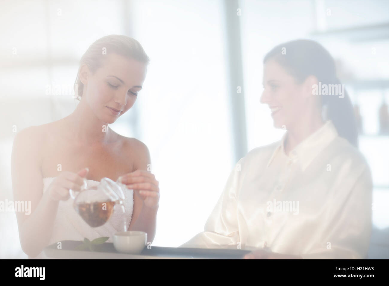 Two women in spa having tea Stock Photo - Alamy