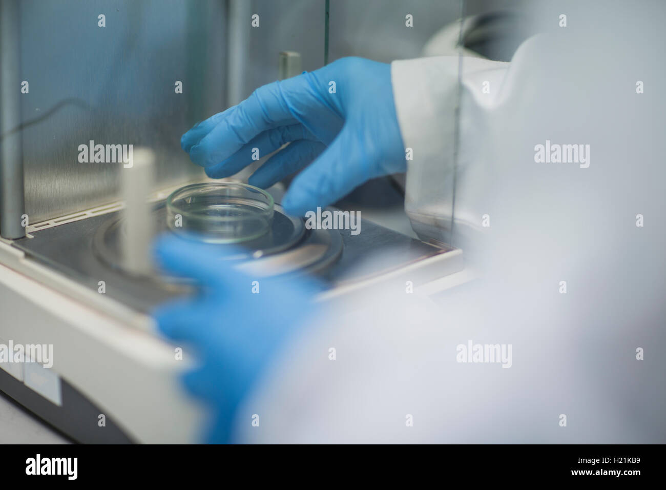 Scientist using scales in lab Stock Photo - Alamy