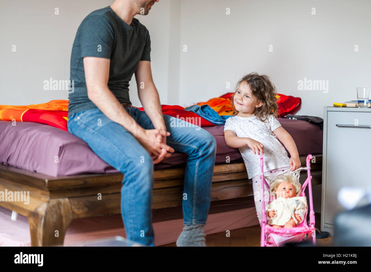 Father and daughter with doll in bedroom Stock Photo - Alamy