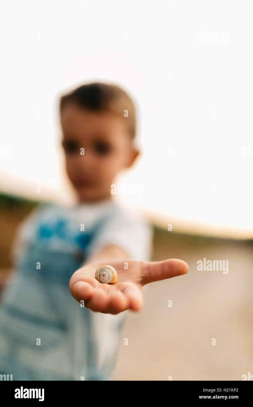 Playing with snail hi-res stock photography and images - Alamy