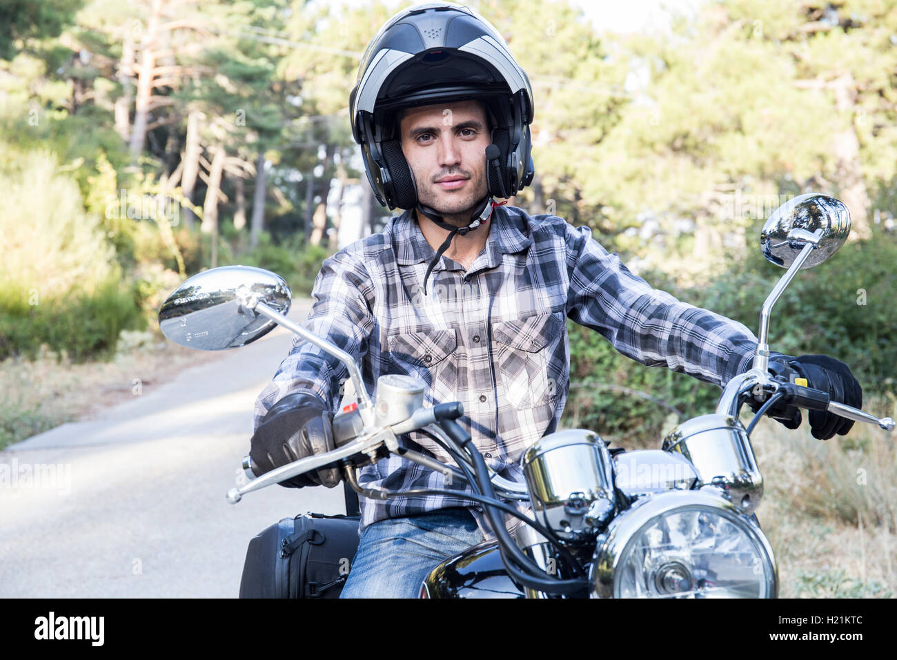 Portrait of man on his motorbike Stock Photo - Alamy