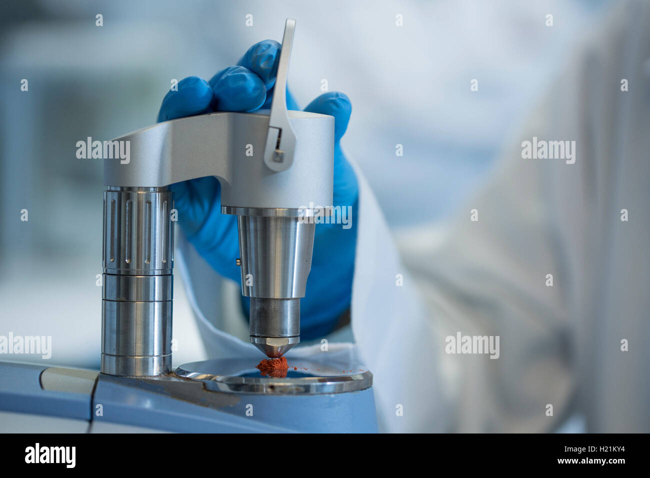 Examination of powder in lab Stock Photo - Alamy