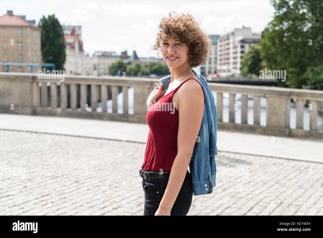 Germany, Berlin, portrait of smiling young woman Stock Photo - Alamy