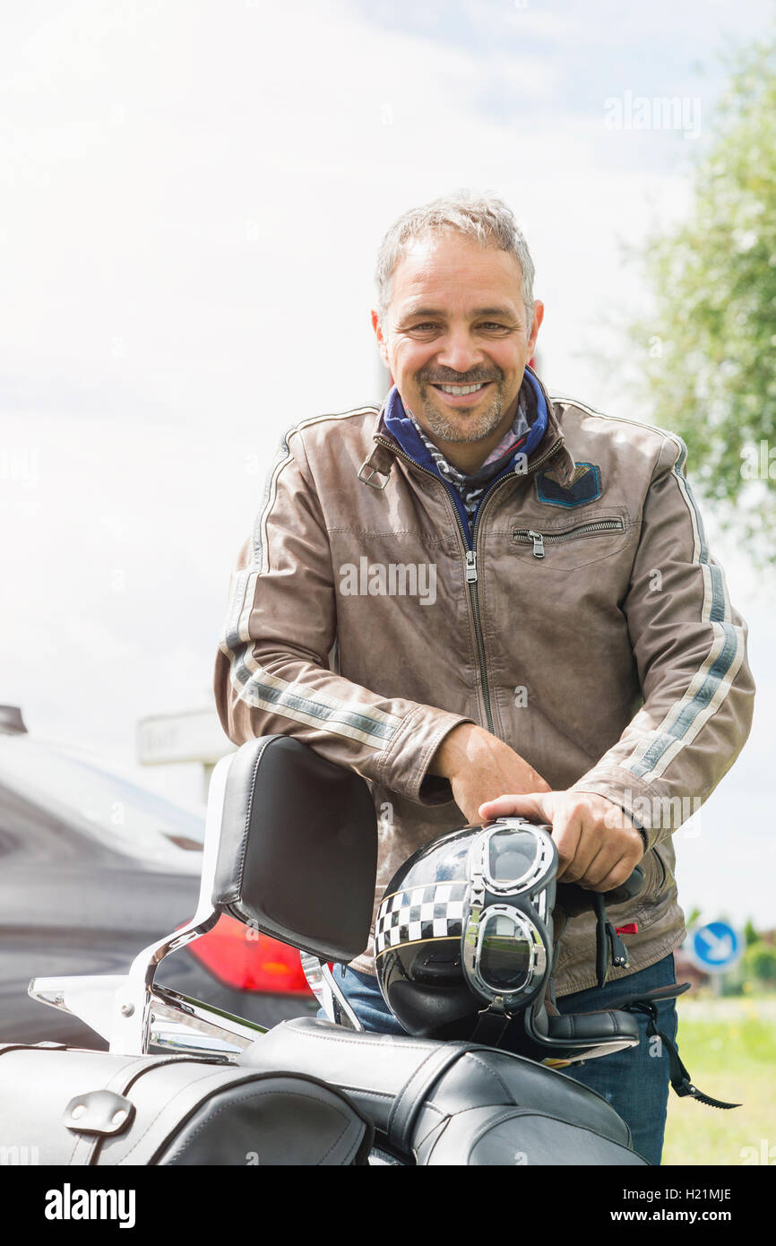 Portrait of happy biker Stock Photo - Alamy