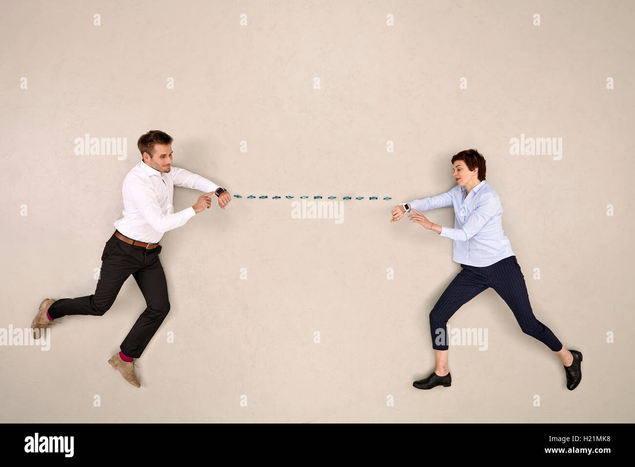 Two business colleagues connected via smartwatch Stock Photo - Alamy