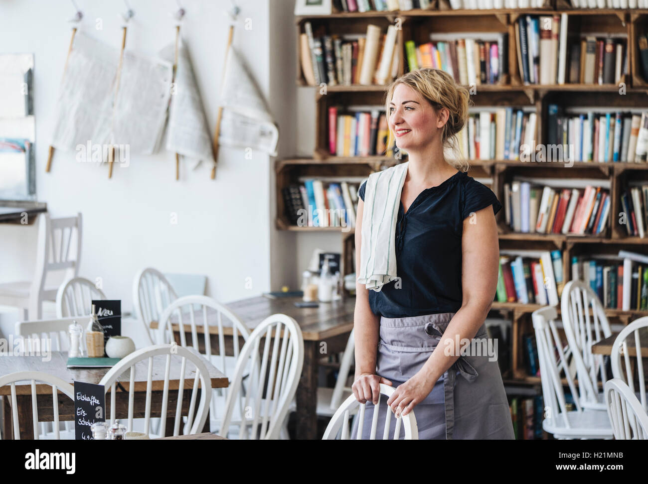 Woman looking at dish in a cafe hi-res stock photography and images - Alamy