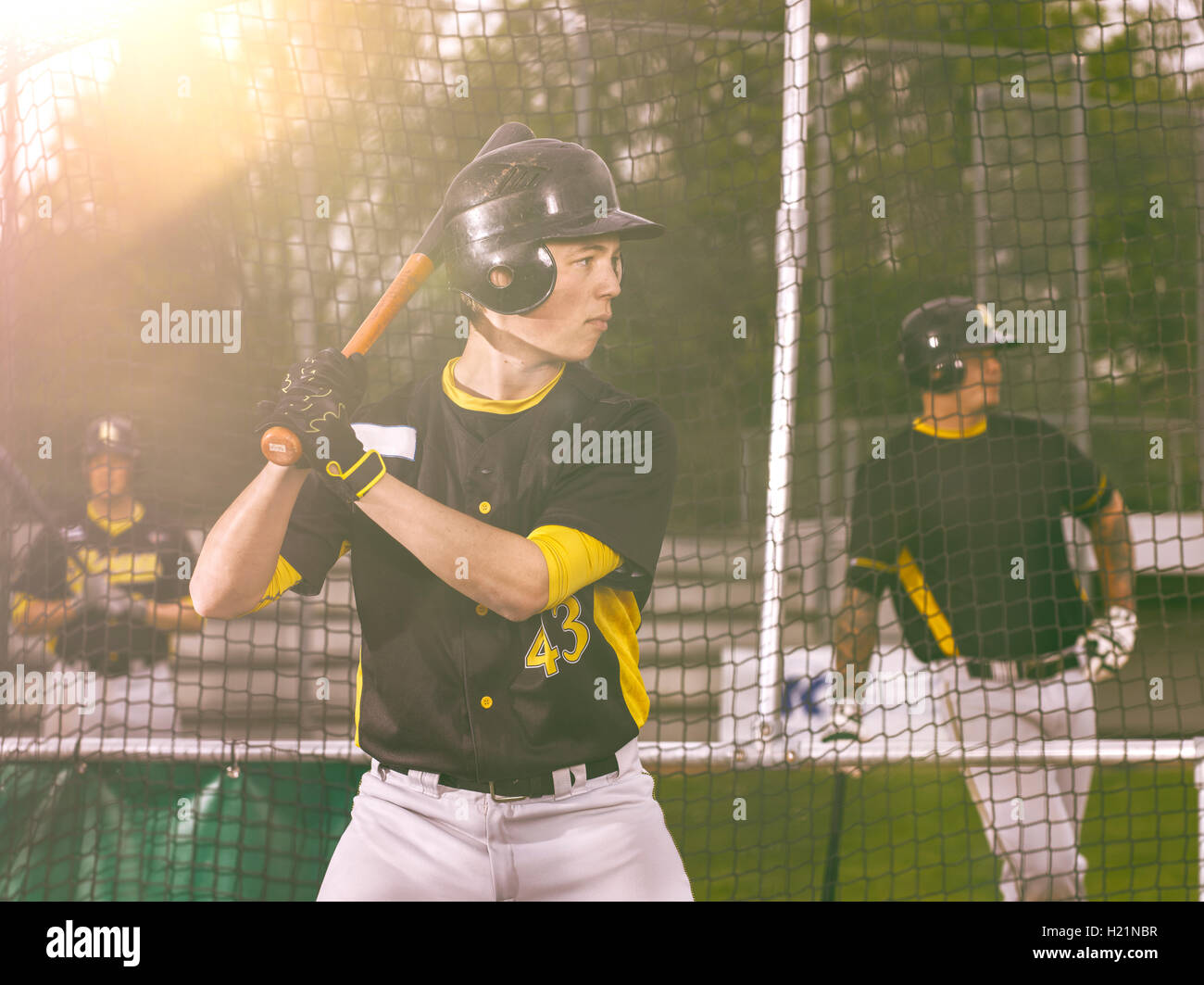 Baseball player holding bat looking hi-res stock photography and images ...