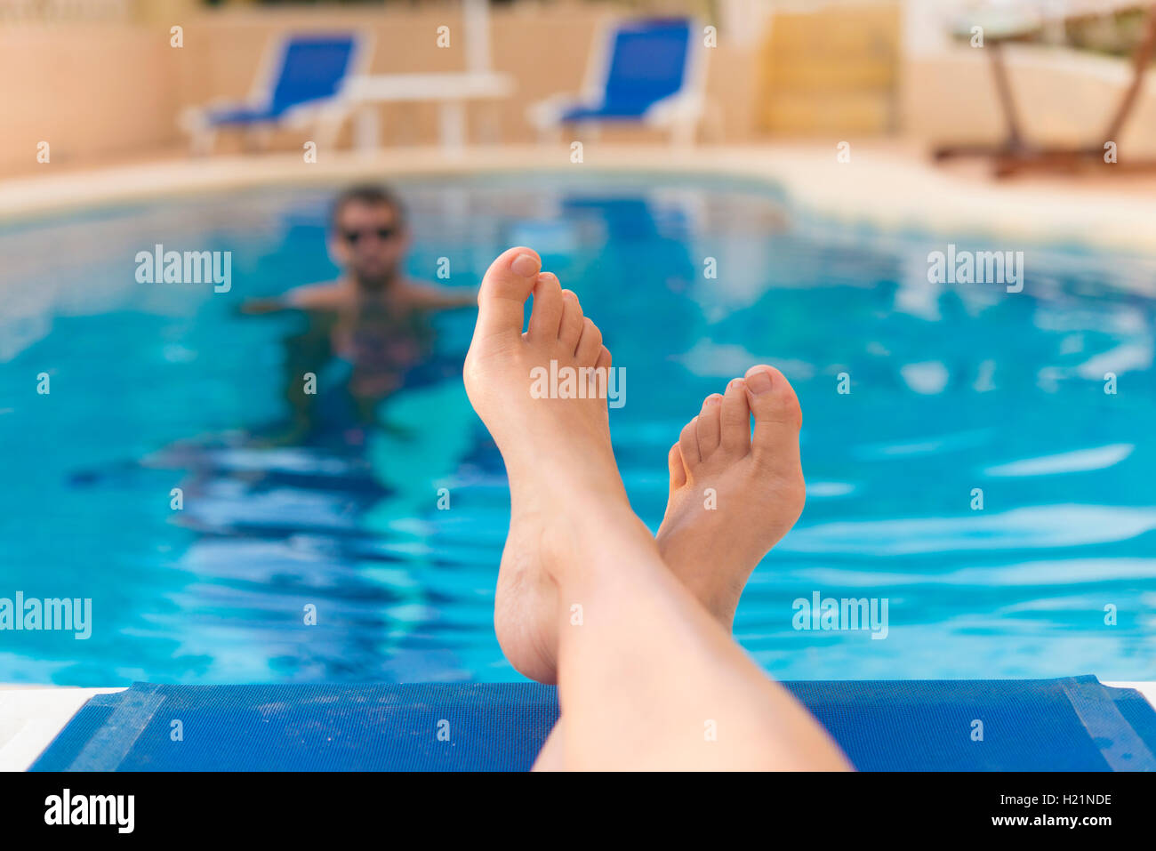 Feet legs on swimming pool hi-res stock photography and images - Alamy