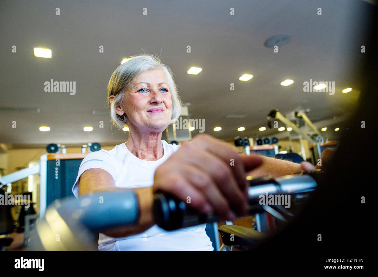 Mature woman working out in fitness gym Stock Photo - Alamy