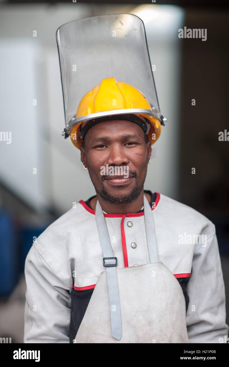 Portrait of confident worker wearing safety helmet Stock Photo - Alamy