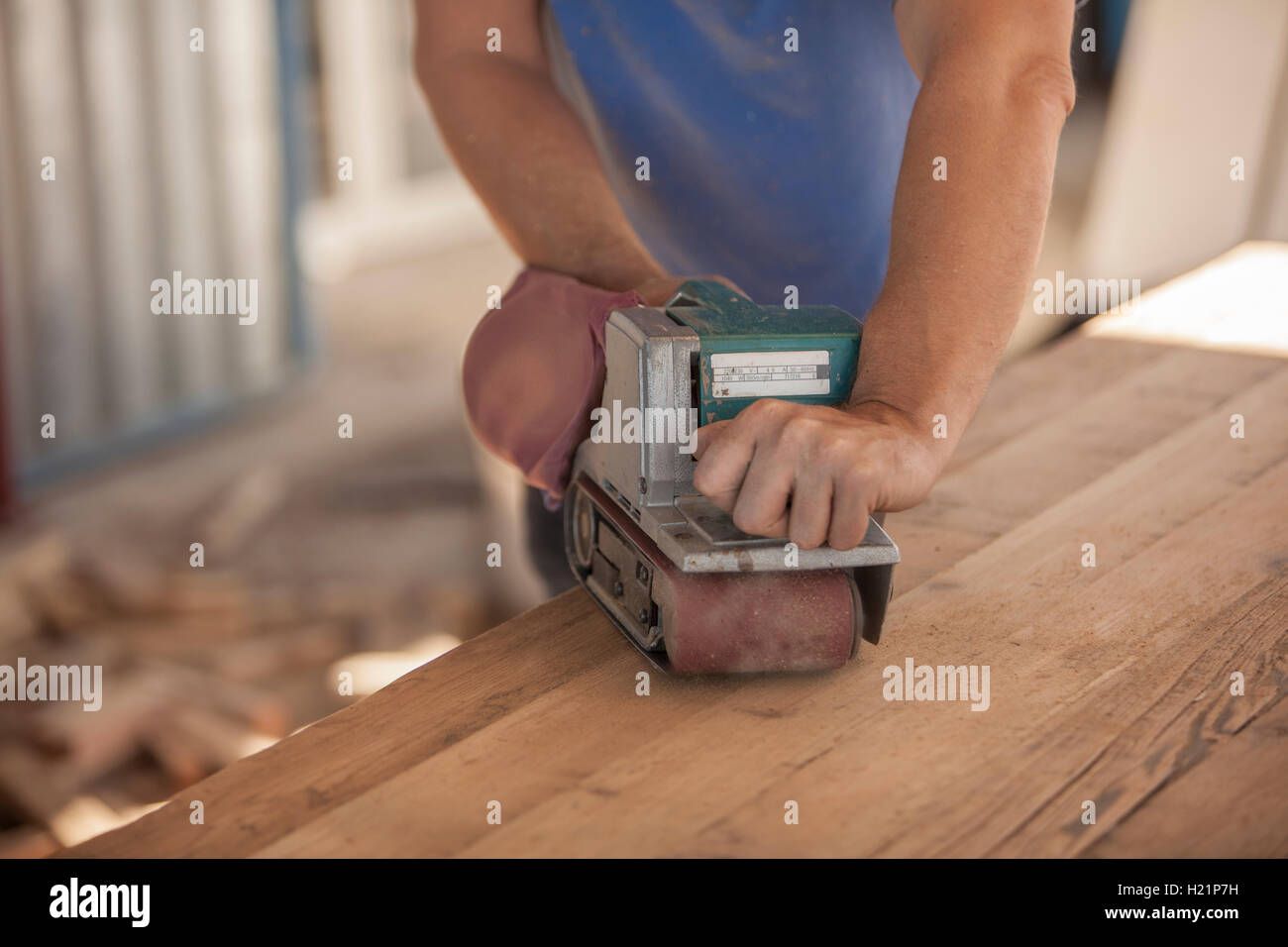 Carpenter using wood sander Stock Photo - Alamy