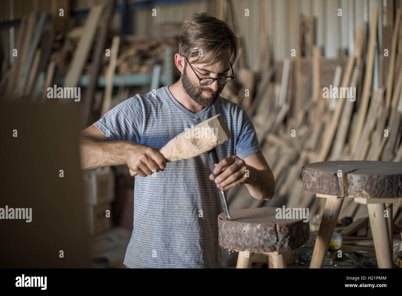 Carpenter using a chisel Stock Photo - Alamy