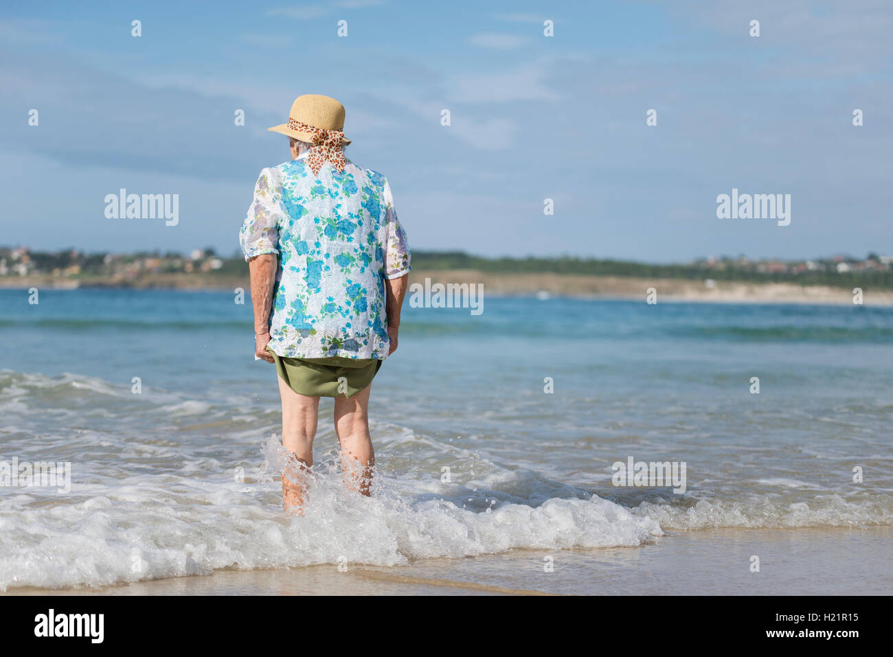 Back view of senior woman at seashore Stock Photo - Alamy