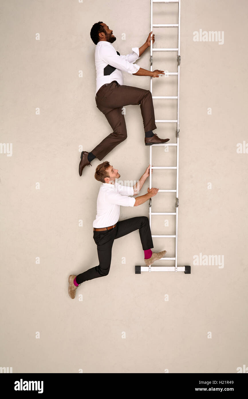 Two businessmen climbing ladder Stock Photo - Alamy