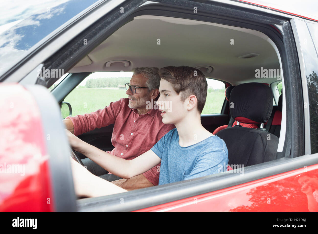 Father and son driving a car hi-res stock photography and images - Alamy