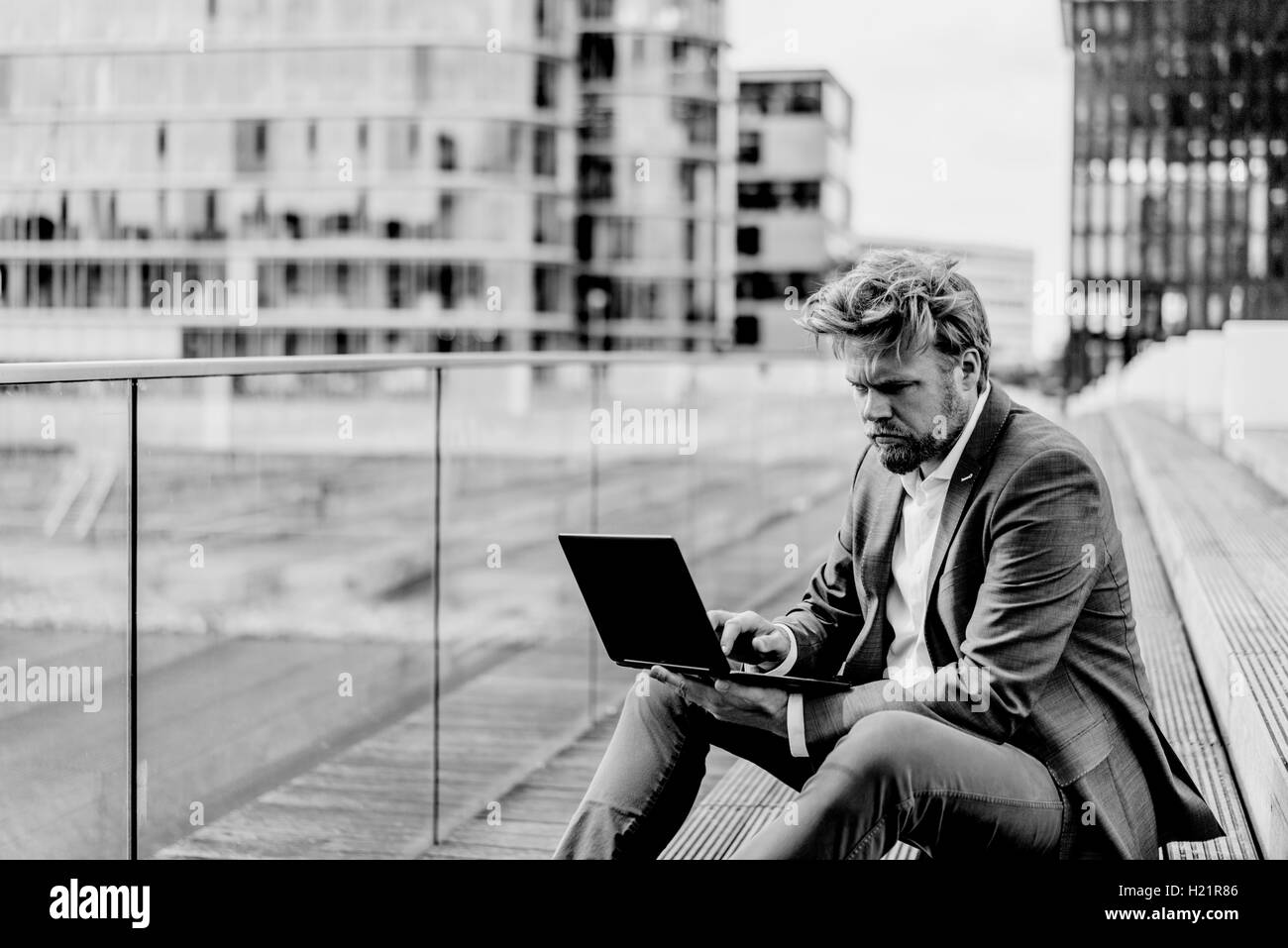 Mature businessman using office computer Black and White Stock Photos ...