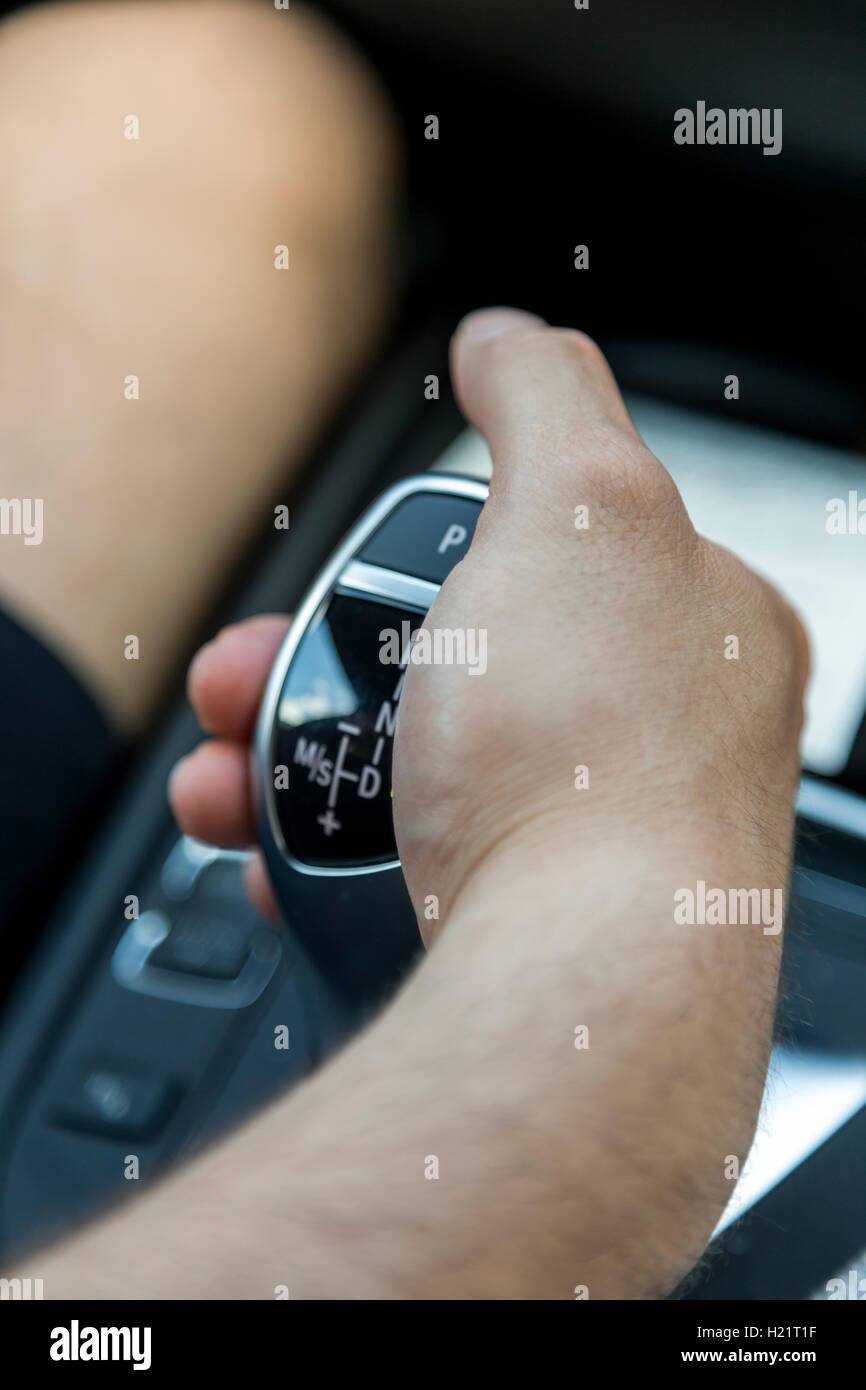 Man's hand on gearshift, close-up Stock Photo - Alamy