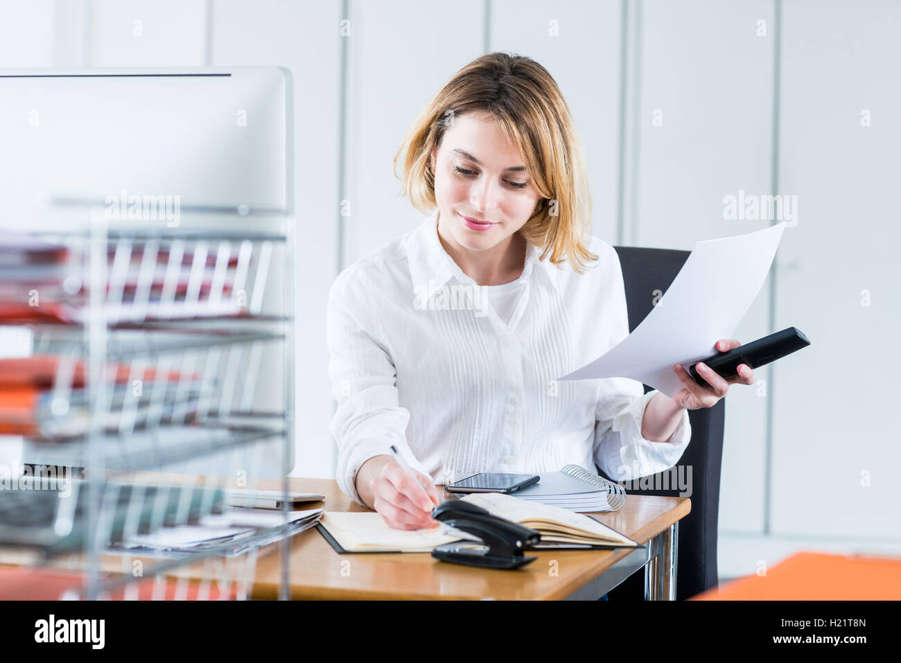 Office worker at desk Stock Photo - Alamy