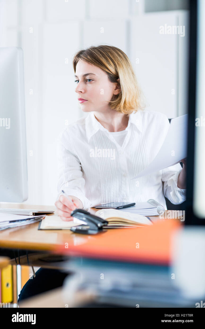 Office worker at desk Stock Photo - Alamy