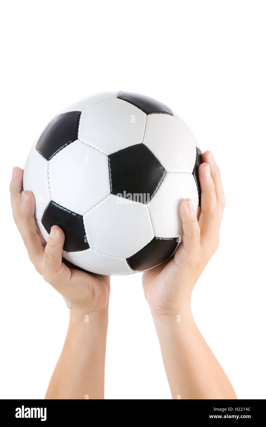 Human hand raising soccer ball Stock Photo - Alamy