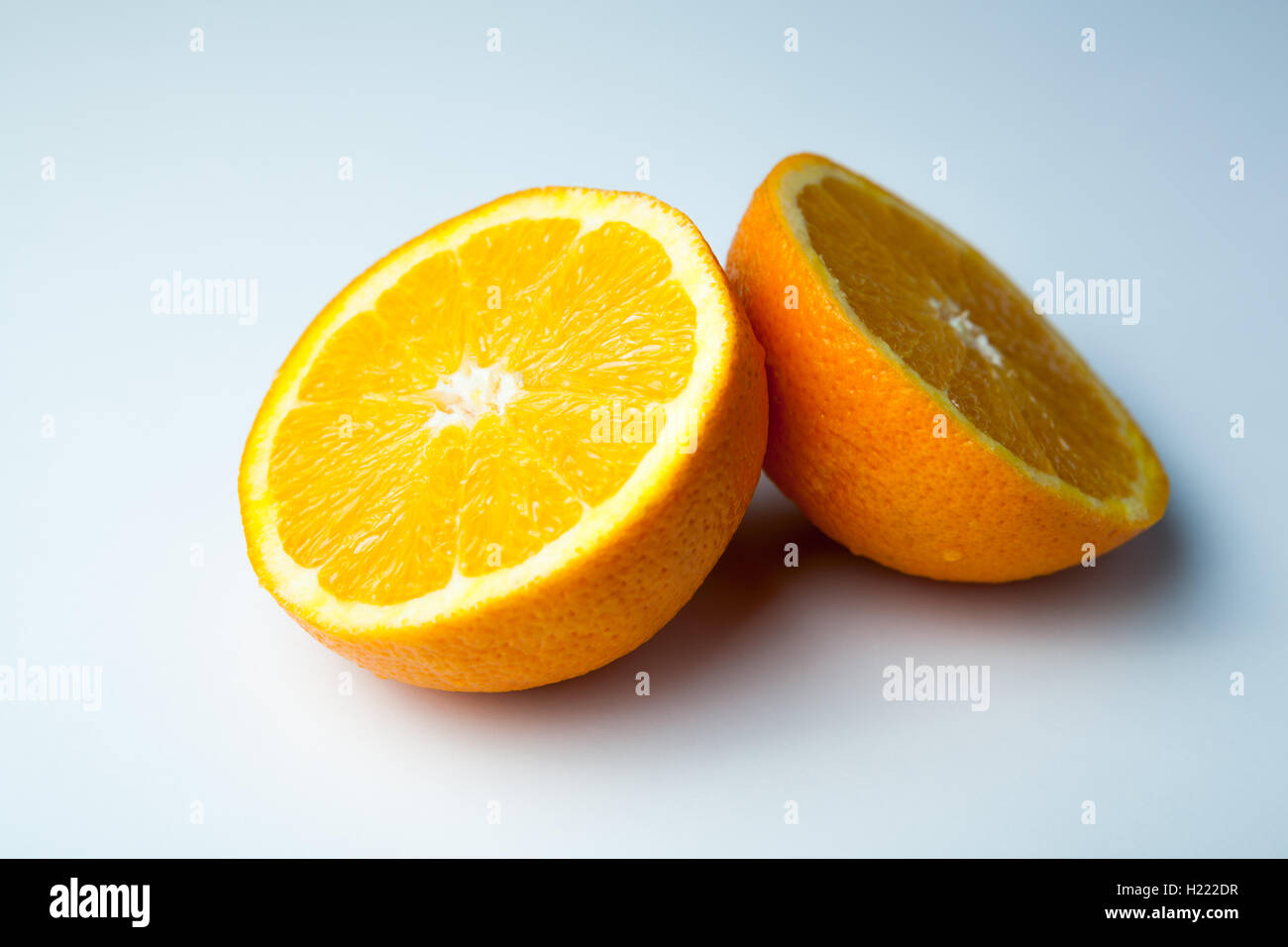 two half slices of orange Stock Photo - Alamy